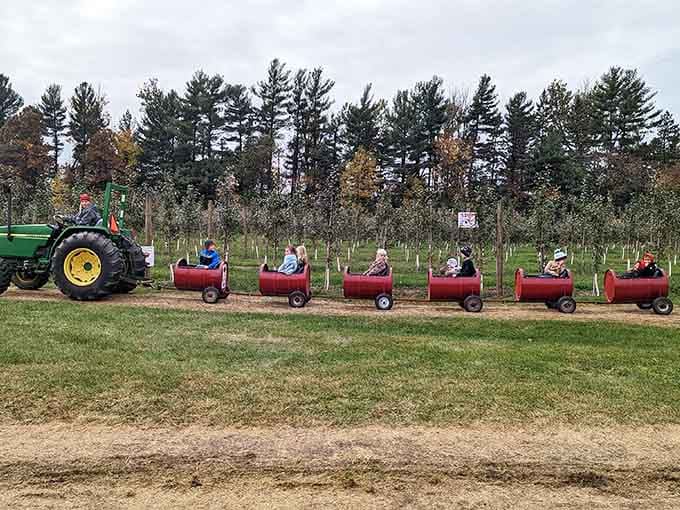 Those red barrels pulled by a tractor are basically the Minnesota version of a wine country tour bus.