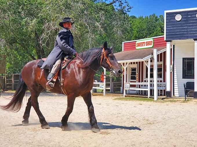 Even the cavalry looks right at home patrolling past the Sweet Shop in full period costume.