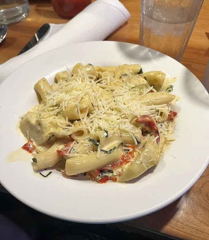 House-made pasta tossed with sun-dried tomatoes and fresh basil, proving Italian comfort food thrives in small-town Ohio.