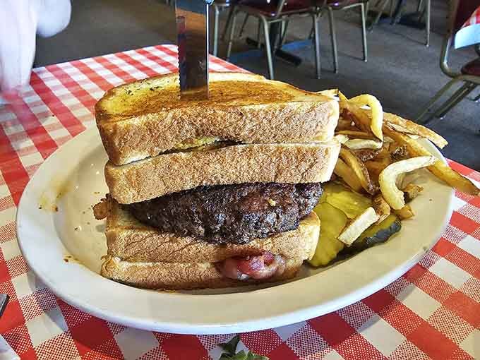 When a burger meets grilled cheese as its bun, you know someone in the kitchen understands pure joy.