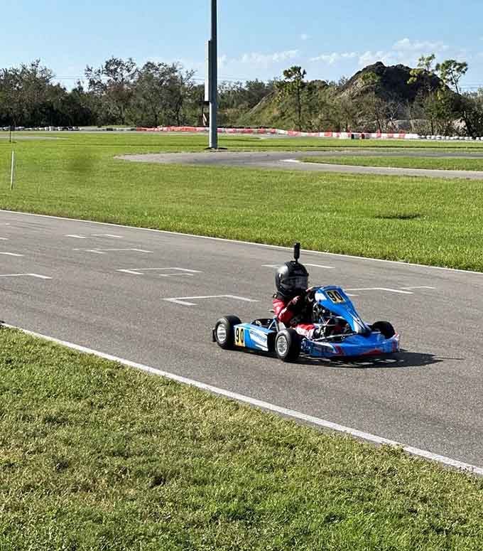 Surrounded by lush greenery, this compact speedster navigates the course with precision that belies its small stature and size.