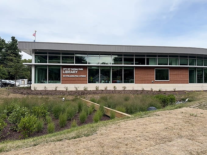 The modern library building surrounded by native plantings because even the landscaping here has progressive environmental credentials.