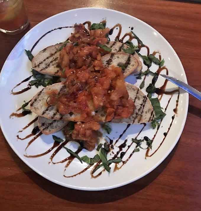 Bruschetta drizzled with balsamic reduction, because even appetizers deserve to look like edible art installations here.