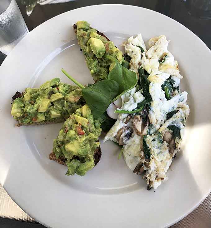 Avocado toast meets egg white omelette in this health-conscious plate that still tastes indulgent.