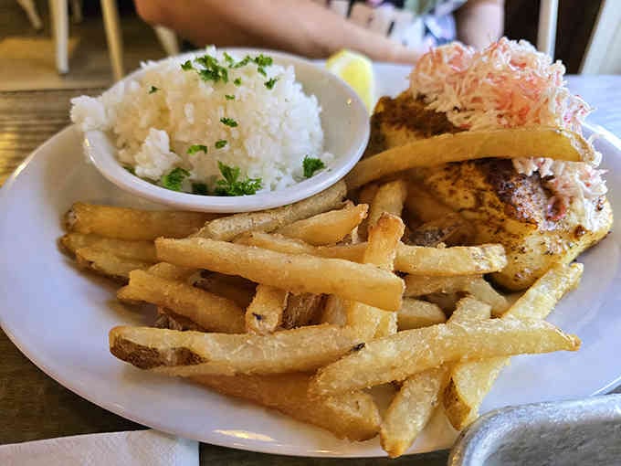 Fish meets Southern comfort when cheese grits join the party, creating the ultimate coastal-meets-Bluegrass fusion.