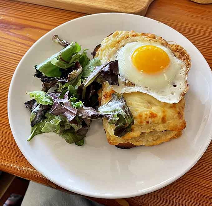 The Croque Madame sits there all golden and egg-topped, basically daring you to find a more photogenic breakfast sandwich.