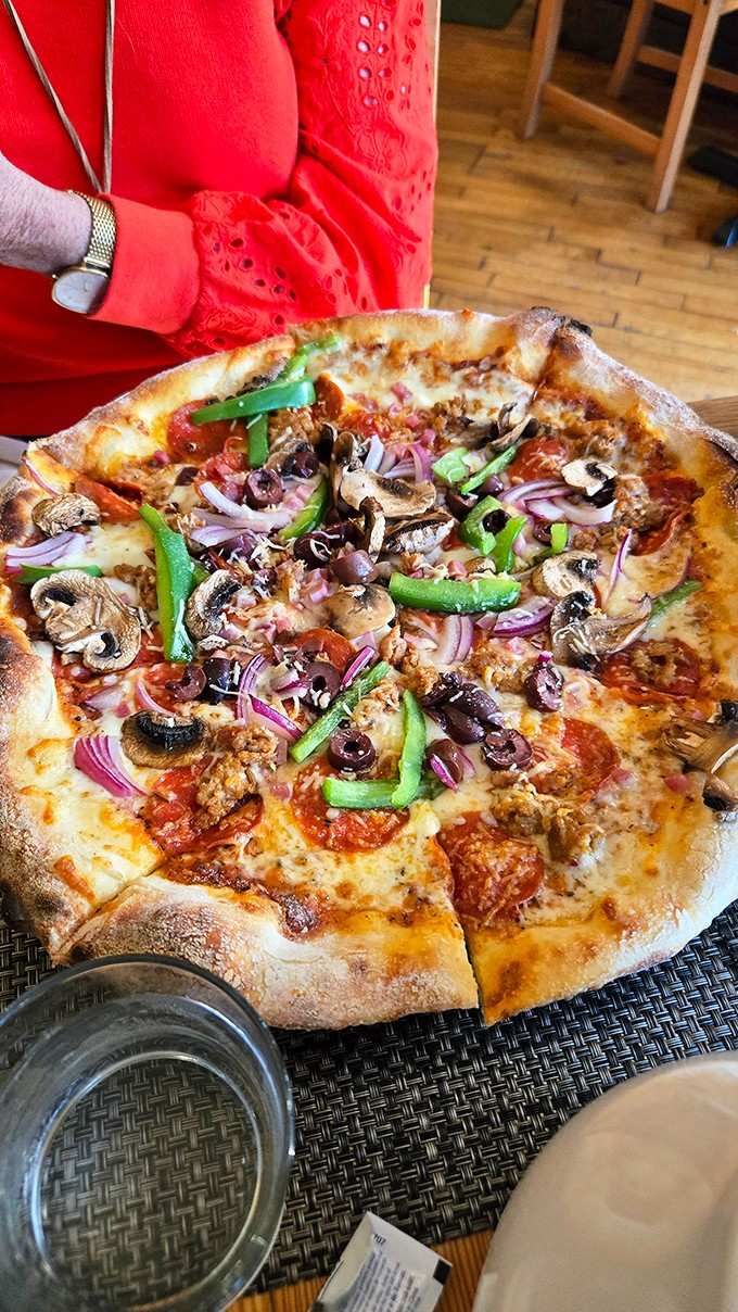 The Supreme pizza doesn't mess around, piling on toppings like it's trying to win an award for generosity.