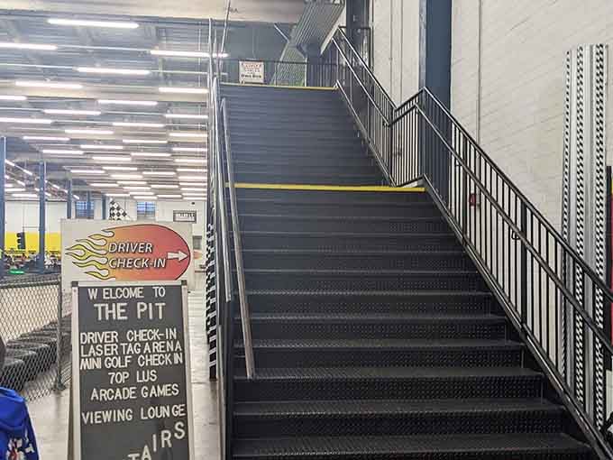 Those stairs lead to elevated viewing areas, perfect for watching friends navigate turns with varying degrees of success.