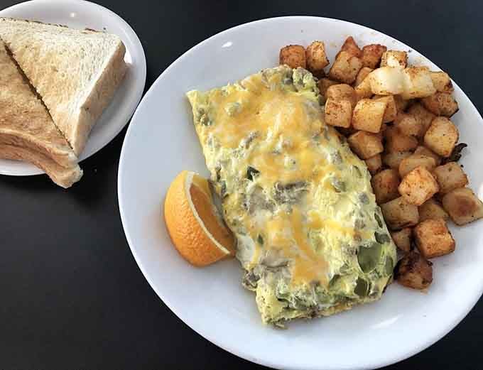 An omelet so loaded with goodness it needs its own zip code and a forklift to serve.