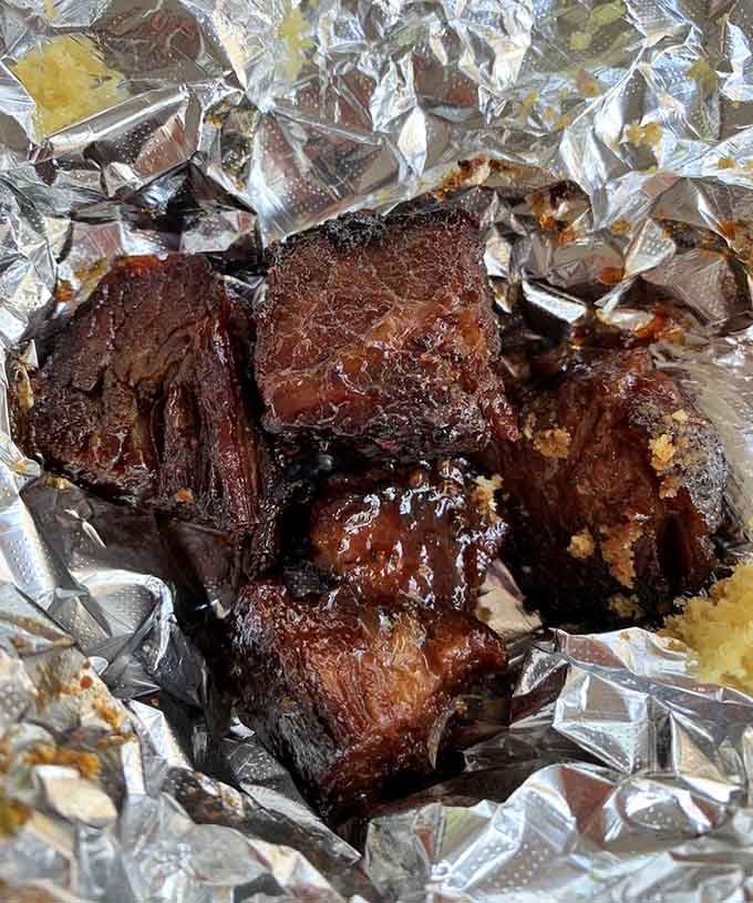 Burnt ends glistening like barbecue treasure, proving that the best things in life are beautifully caramelized and smoky.
