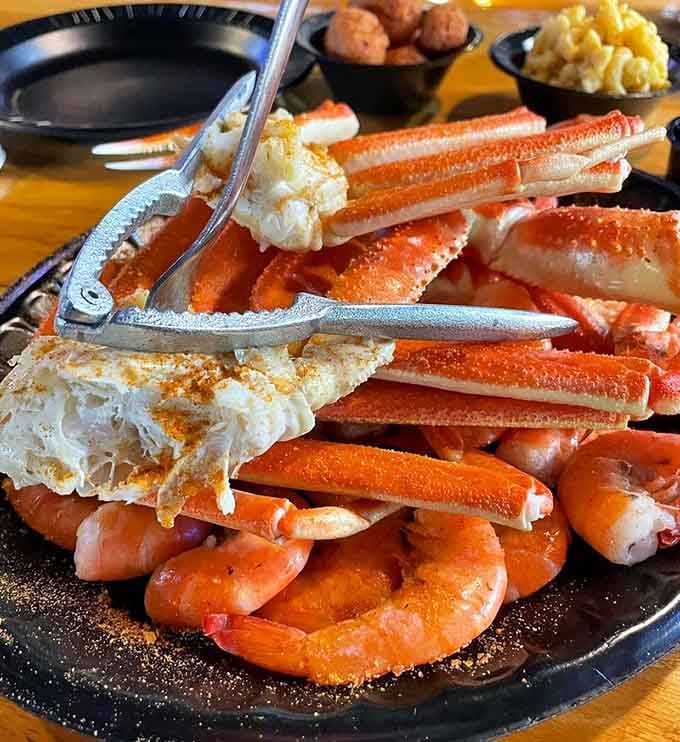 Snow crab legs and boiled shrimp create a hands-on feast that's messy, fun, and absolutely worth it.