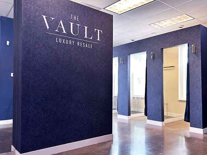 The dramatic navy accent wall sets a sophisticated tone before you even glimpse the treasures waiting in those bright showrooms beyond.
