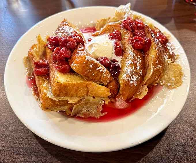 French toast dusted with powdered sugar and crowned with berries, because sometimes breakfast needs to feel fancy.