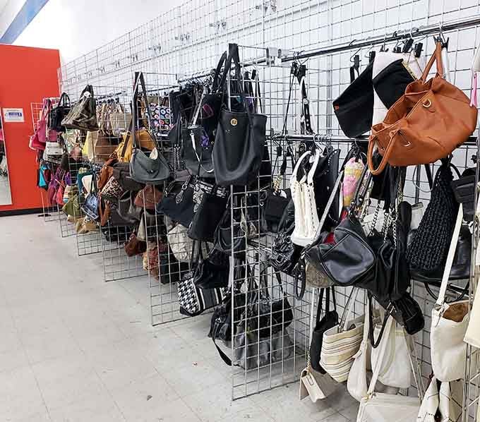 Handbags and purses dangling like fashion fruit, ripe for picking by savvy shoppers with discerning taste.