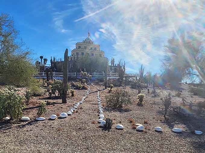 Sunlight dances across the garden paths where cacti outnumber the visitors, exactly as it should be here.