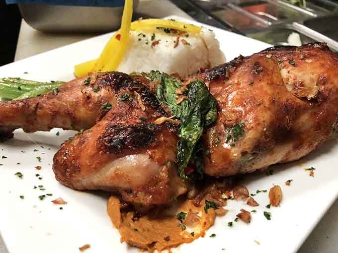 Thai-roasted chicken that's beautifully glazed and plated like it belongs in a much fancier establishment.