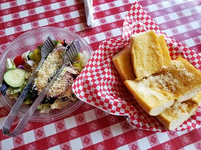 Garlic bread and salad: the opening act that's so good you almost forget the headliner is coming.