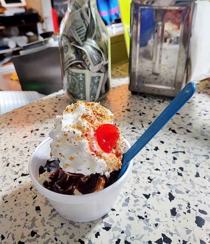 That cherry on top isn't just decoration, it's the exclamation point on a perfectly constructed hot fudge sundae.