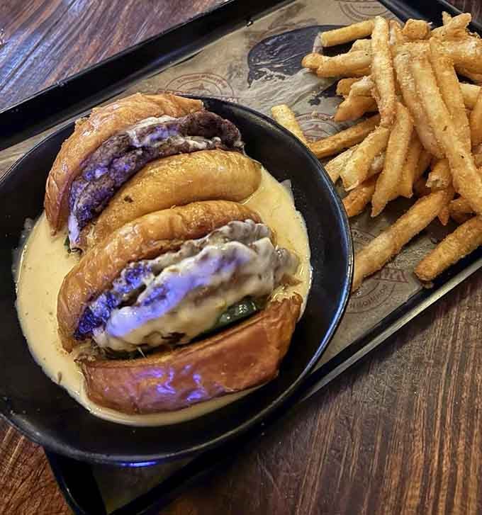 Two perfectly seared patties stacked high with all the fixings, because one patty is for amateurs and quitters.