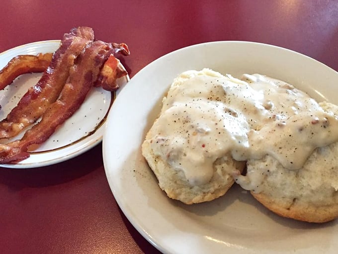 Simple perfection on two plates&mdash;biscuits smothered in peppery gravy alongside bacon that actually knows how to be crispy.
