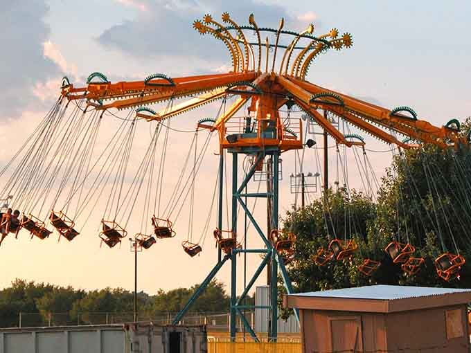 Fiesta Swings at sunset, where centrifugal force meets golden hour magic in perfect harmony.