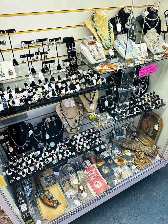 Vintage jewelry sparkles under display lights, each piece carrying stories from proms, weddings, and adventures long past.