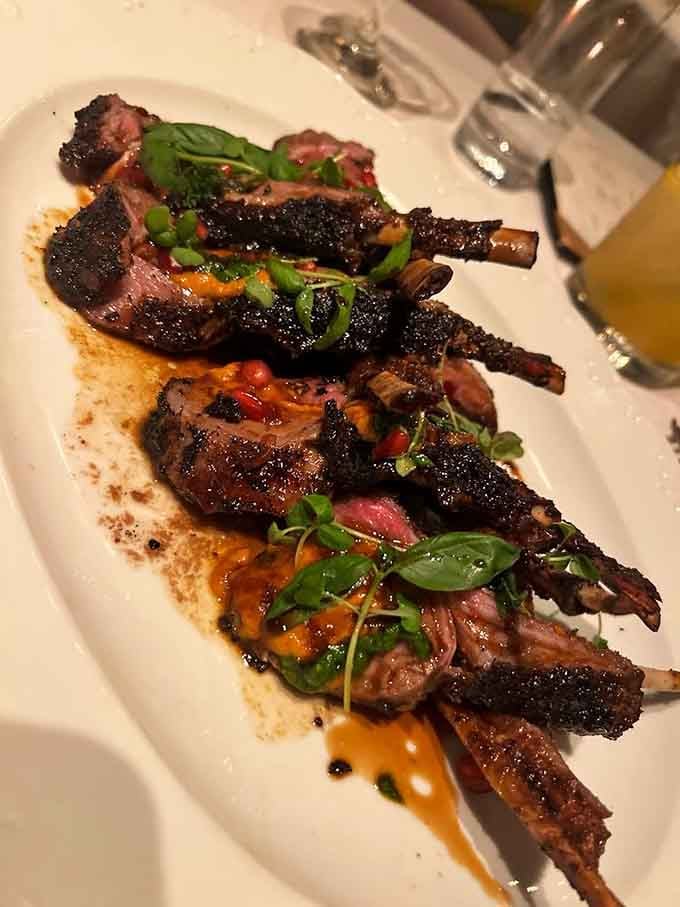 Rack of lamb presented like edible artwork, proving that sometimes the best things in life are worth the splurge and the calories.
