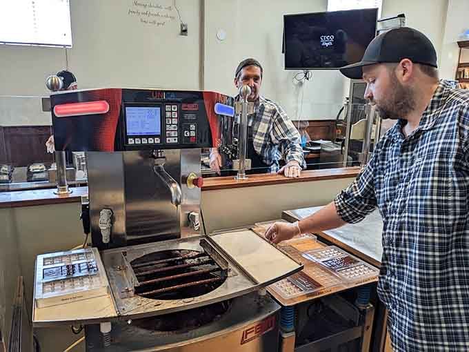 Modern chocolate-making equipment transforms cacao into edible art while you watch the entire mesmerizing process.