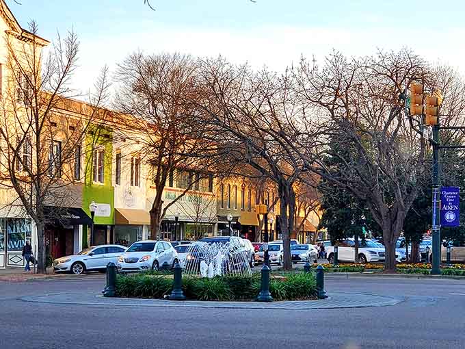 The town square fountain sits surrounded by bare winter trees and historic buildings that anchor this equestrian community.