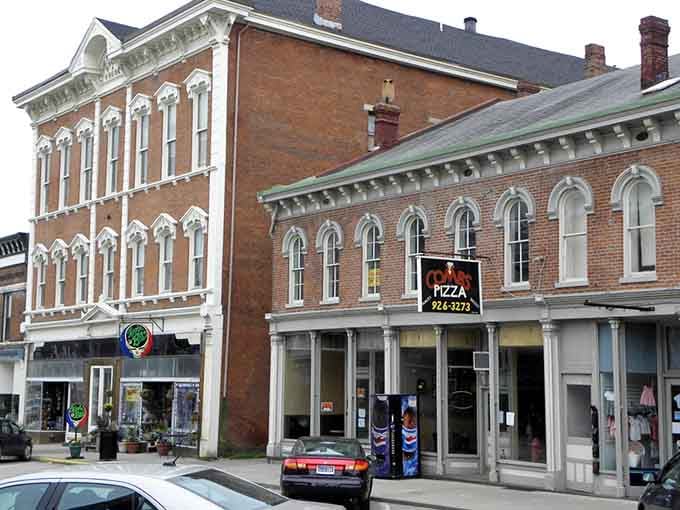 Tall arched windows and detailed brickwork show the kind of craftsmanship that makes modern builders weep with envy.