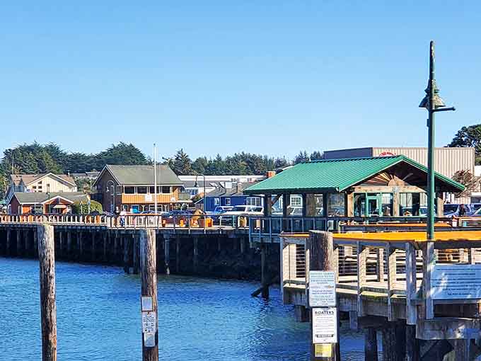 Bandon's waterfront boardwalk invites leisurely strolls where fishing boats and pleasure craft share the harbor peacefully.