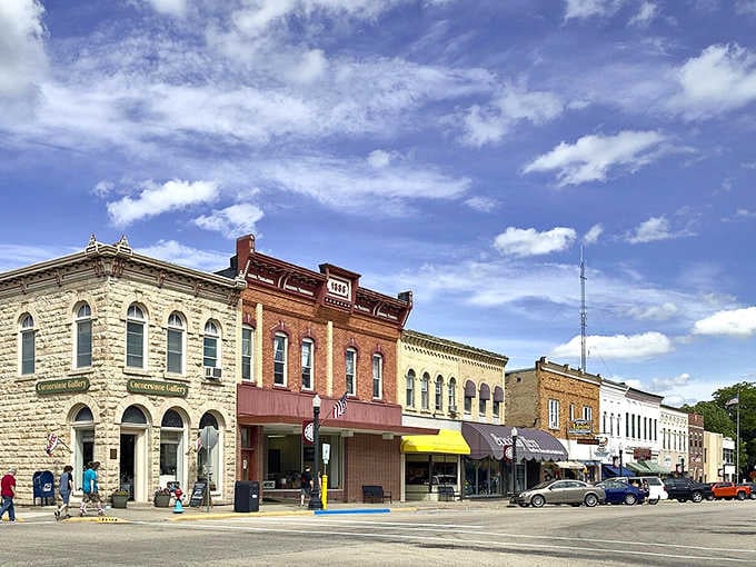 Historic storefronts stand shoulder to shoulder like old friends, each one adding character to this perfectly preserved downtown scene.