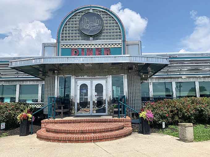 The Art Deco entrance with its curved glass blocks and checkered details screams authentic vintage diner.
