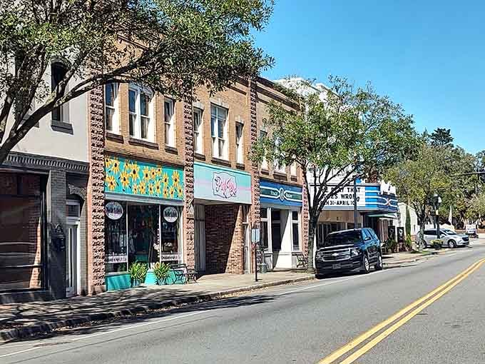 Colorful storefronts bring vibrant energy to this tree-lined street where local shops offer treasures you won't find anywhere else.