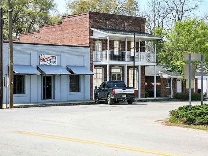 Double-decker porches and brick facades create architectural harmony that modern strip malls could never hope to match.