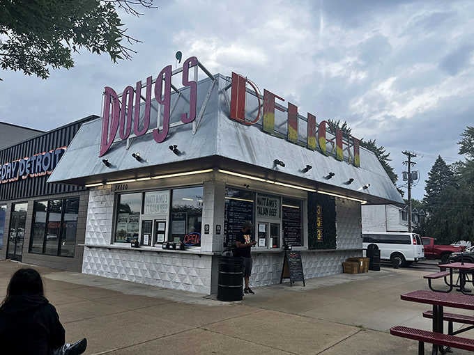 The rainbow lettering on that vintage sign practically shouts "happiness lives here" to everyone driving past this corner.