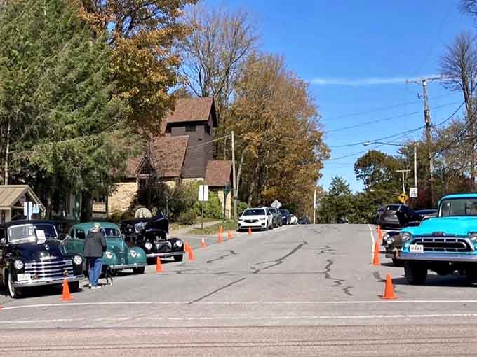 Classic cars and autumn colors transform an ordinary street into a rolling museum of American automotive nostalgia.