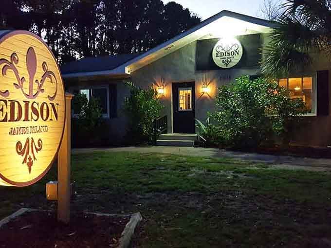 The glowing sign at twilight creates an inviting beacon that draws you in like a lighthouse guiding ships home.