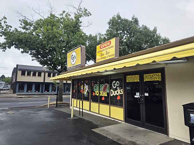 That cheerful yellow exterior practically radiates sunshine, promising bright flavors and even brighter hospitality inside those painted windows.