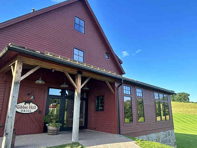 Rolling green fields and rustic barn architecture promise farm-to-table dining that tastes like pure New England countryside.