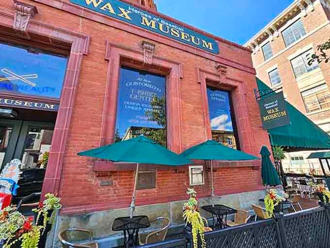 That handsome brick facade with green awnings houses waxy baseball legends frozen in their greatest moments of diamond glory.