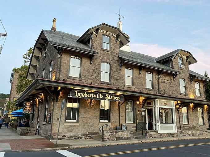Evening lights glow warmly from this historic stone station, welcoming travelers just as it has for generations past.