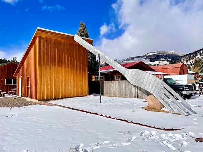 That oversized utensil piercing the winter snow is exactly what it looks like&mdash;pure whimsy frozen in metal.