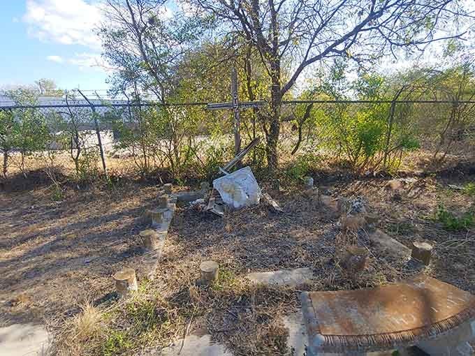 Time has reclaimed this forgotten corner where wild grasses grow tall and rusted metal tells stories of neglect and loss.