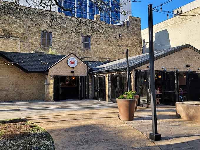 The covered patio beckons like a Southern veranda, where Low Country flavors meet Midwestern hospitality in perfect harmony.