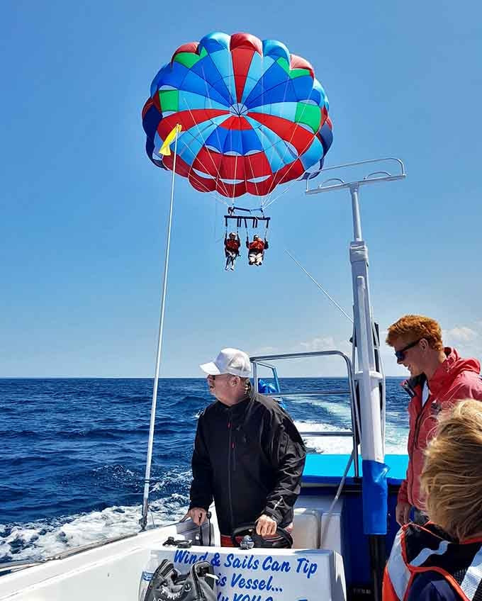 Up, up, and away&mdash;that rainbow parachute lifts adventurers high above the sparkling straits for unforgettable aerial views.