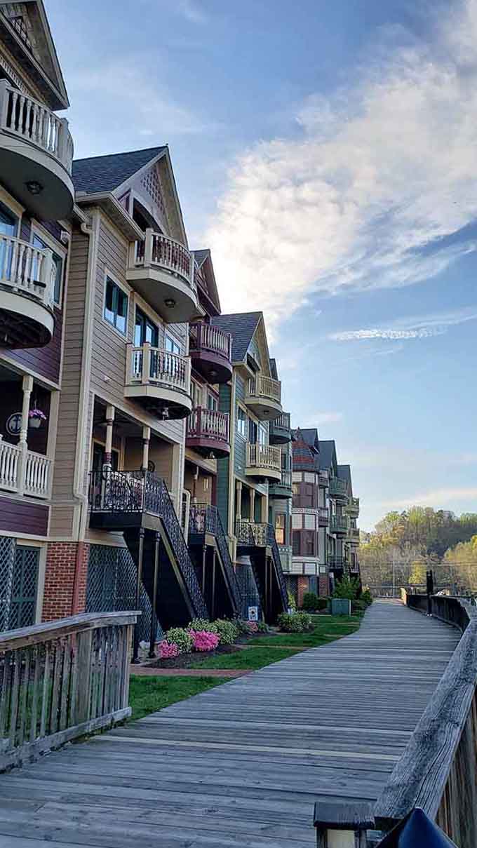 The boardwalk stretches past these pastel beauties, inviting leisurely strolls where every step reveals another architectural treasure to admire.
