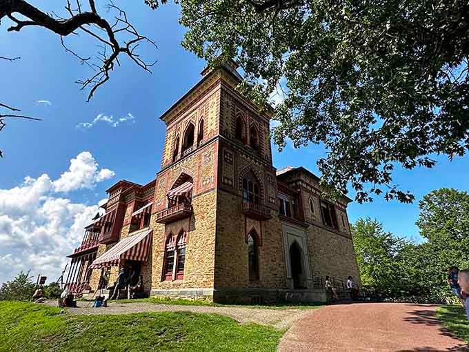 That Italianate tower rising against blue skies proves someone had serious architectural dreams and the budget to match them.
