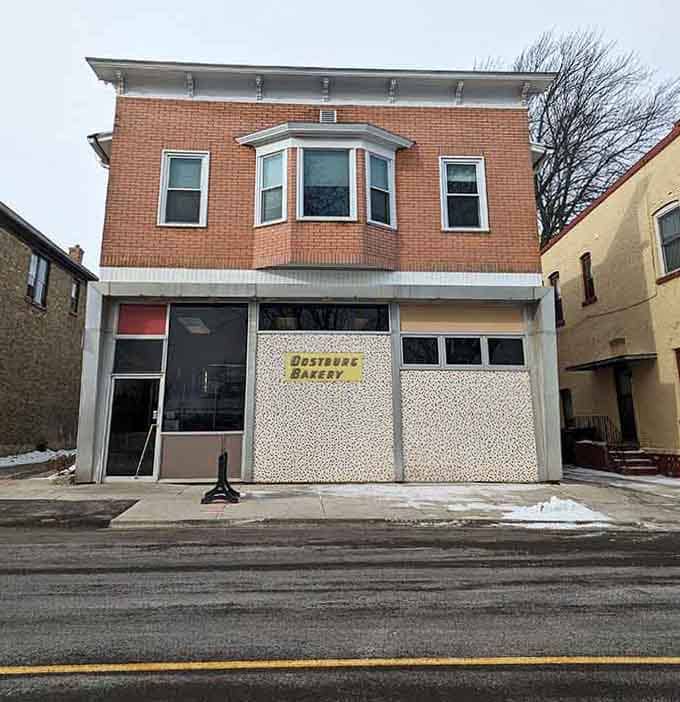 The brick facade and bay window upstairs hint at the building's history, while downstairs the donuts write new stories daily.