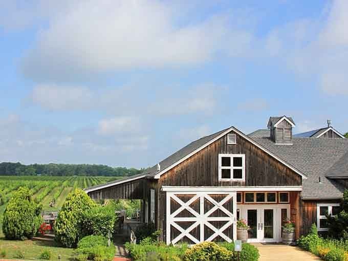 The classic barn-style building sits among the vines like it's been there since Washington crossed the Delaware.